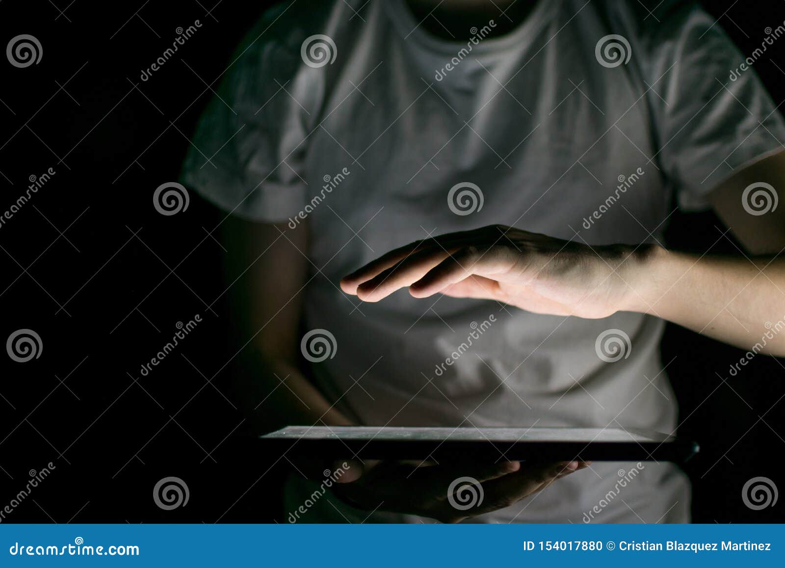 Hand Illuminated by the Light of a Tablet Stock Photo - Image of online ...