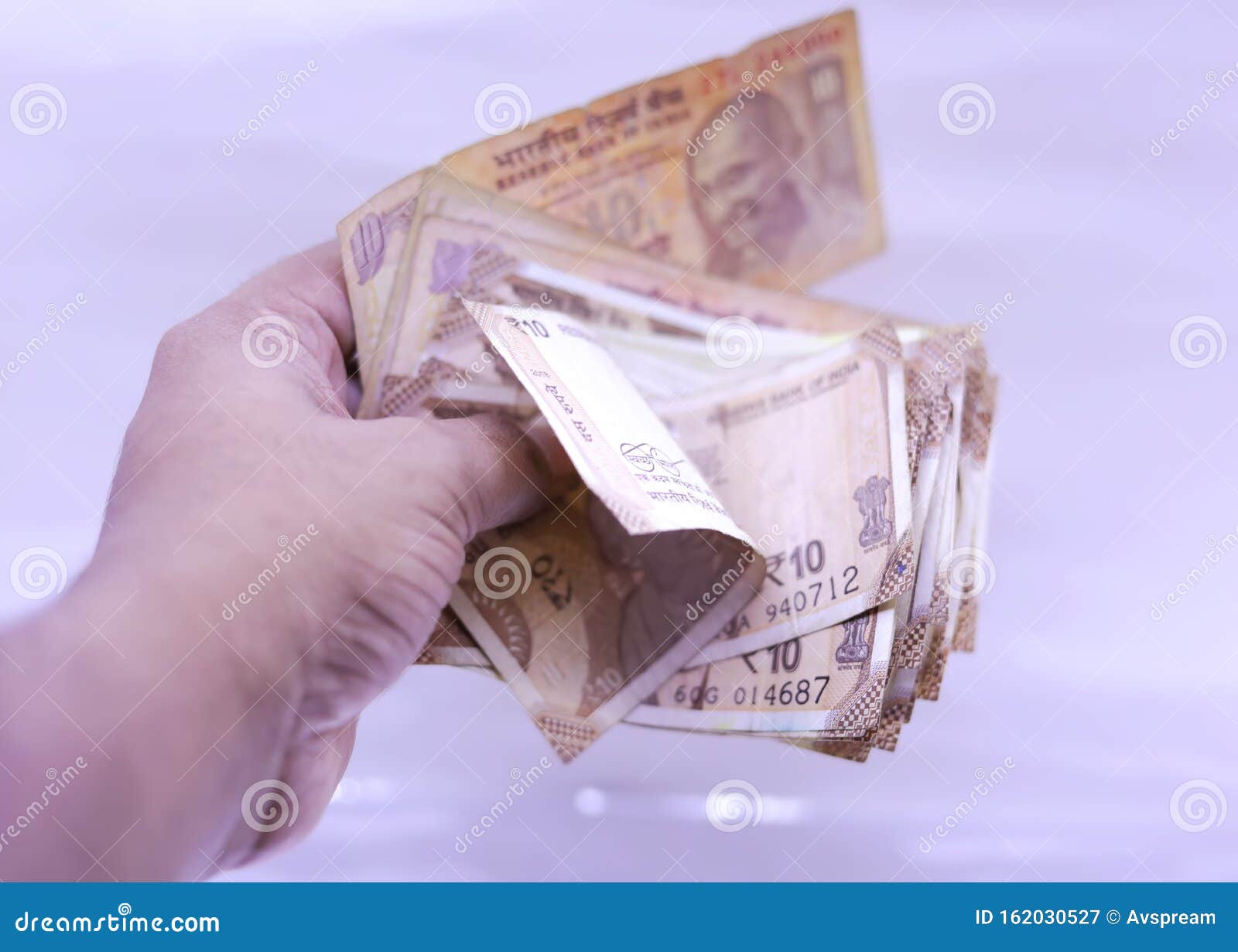 Hand Indian Rupee Notes Stock Photos - Download 447 Royalty Free Photos