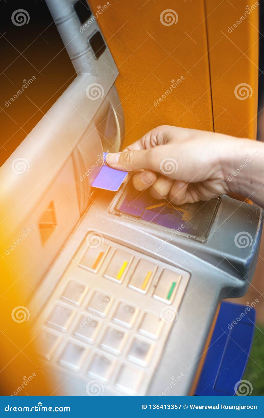 Hand Inserting ATM Card into ATM Bank Machine for Withdrawing Money ...