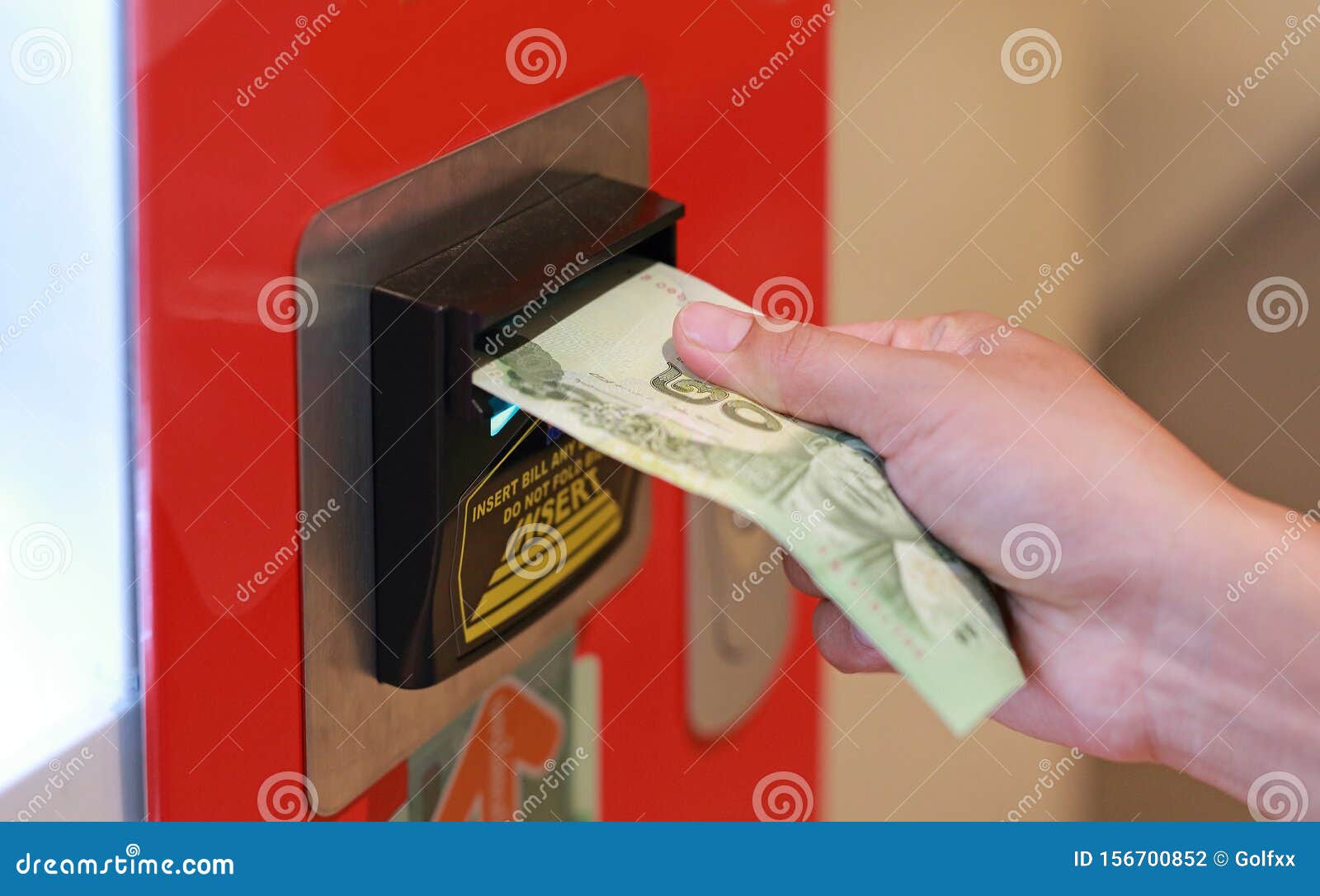 Hand Inserting Banknote into Vending Machine Stock Photo - Image of ...