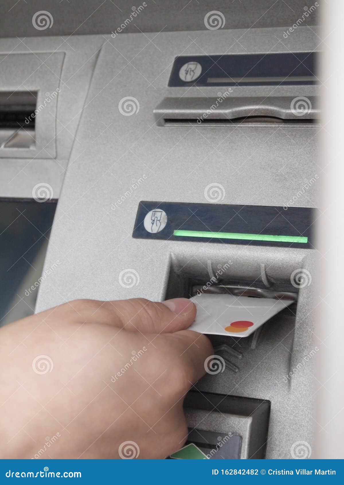 Hand Inserting a Card into a Cashpoint Machine Stock Photo - Image of ...