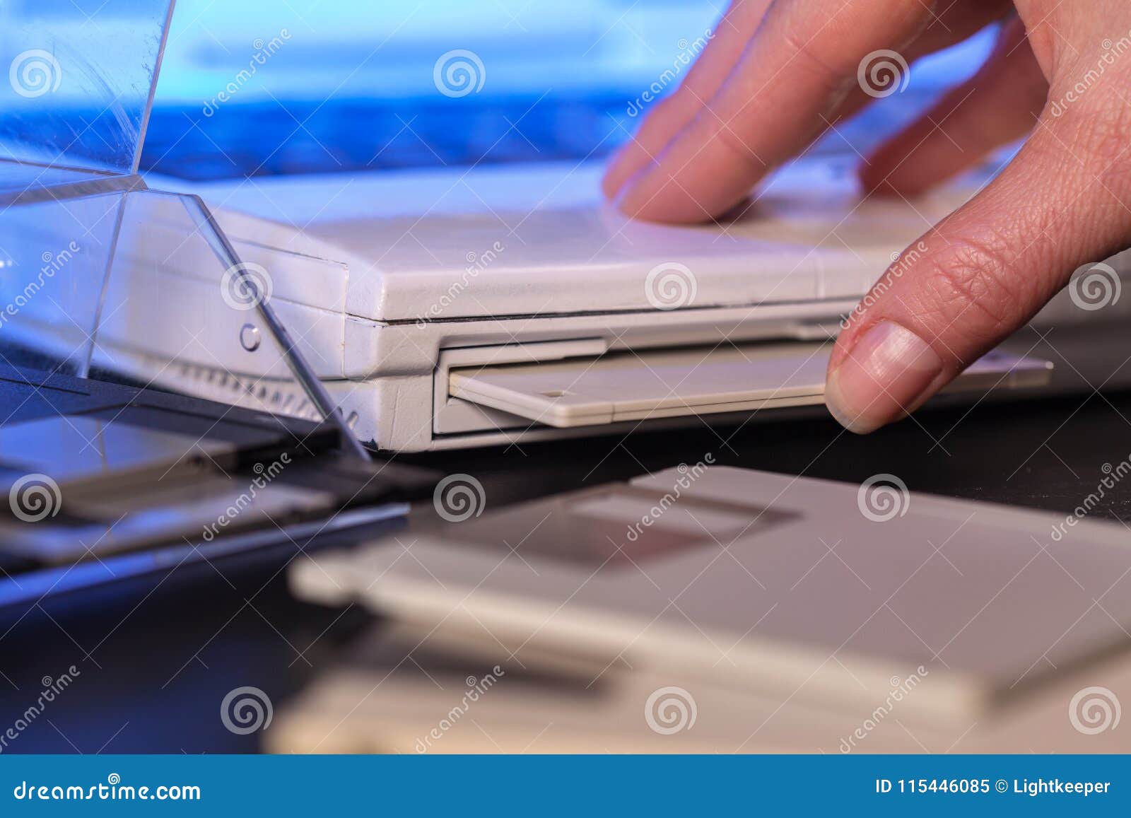 Hand Inserting Floppy Diskette in Old Laptop Computer - Closeup Stock ...