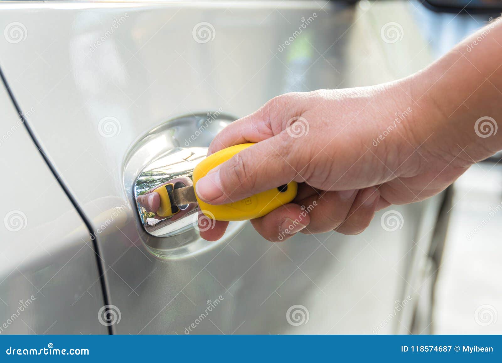 Hand Inserting a Key into the Door of a Car Stock Image - Image of ...