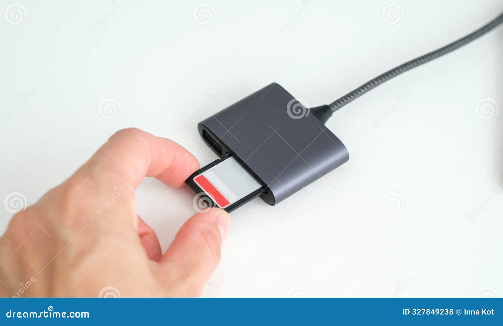 Hand Inserting Memory Card into Laptop Slot on White Background. Stock ...