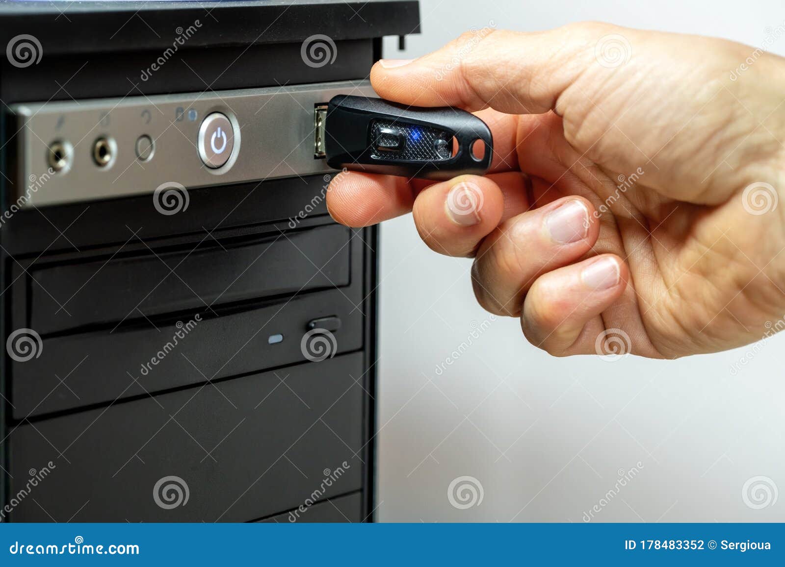 Hand Inserting a USB Flash Drive into a Computer. Stock Photo - Image ...