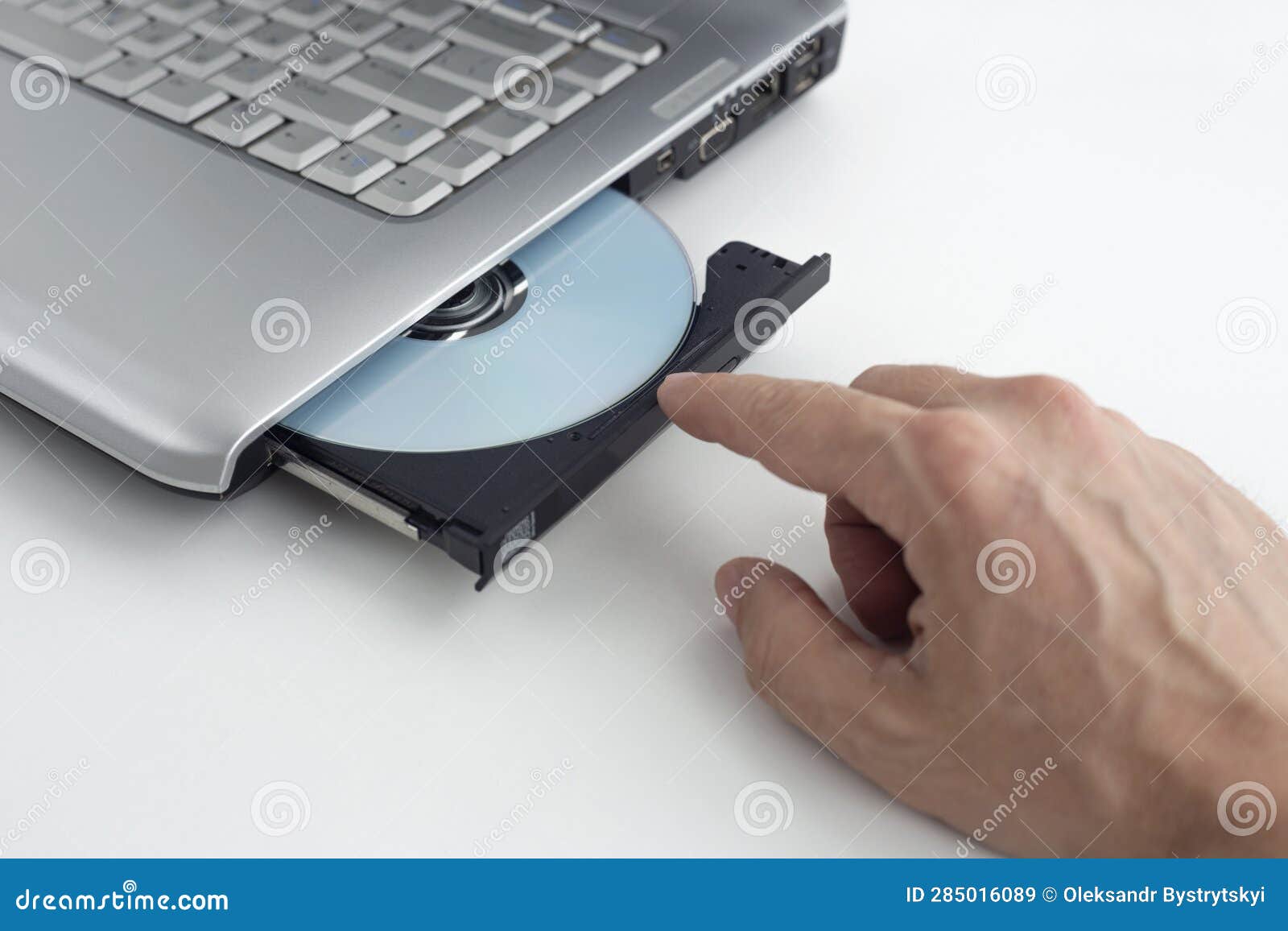 Hand Inserts Dvd Disc into Laptop, Concept of Burning Data To Dvd Stock ...