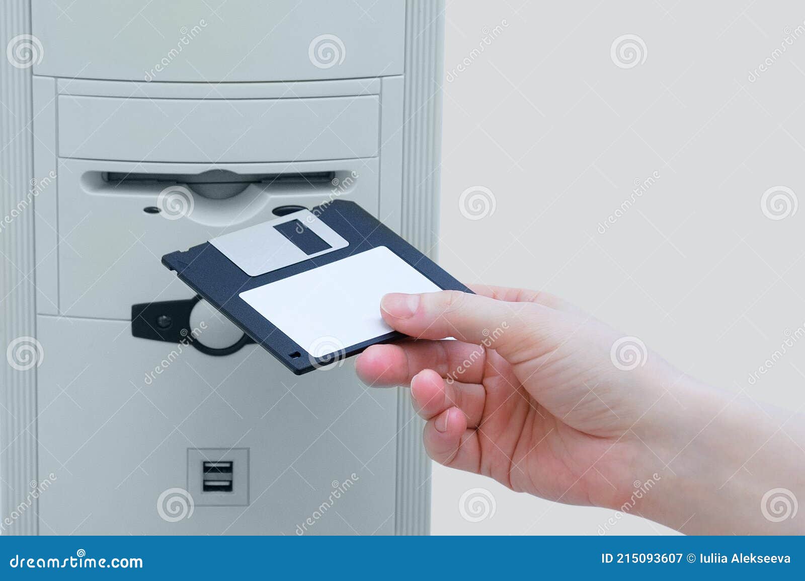 A Hand Inserts a Floppy Disk into Personal Computer. Retro Technology ...
