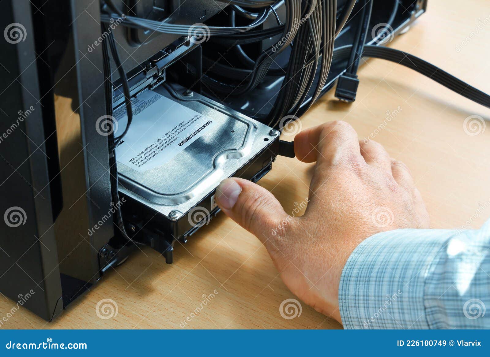 Hand Inserts Hard Disk Memory into System Unit of Computer Stock Image ...