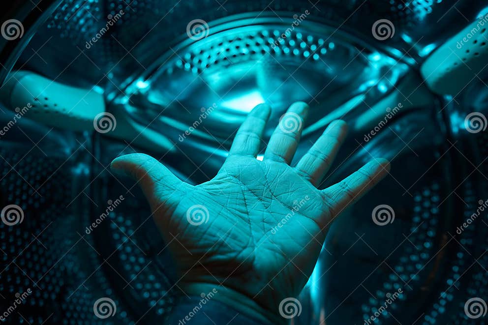 A Hand Inside Washer in a Blue Light, Concept Stock Photo - Image of ...
