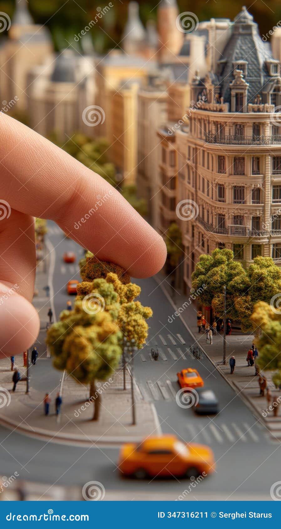 A Hand Interacts with a Detailed Miniature Cityscape, Adjusting Tiny ...
