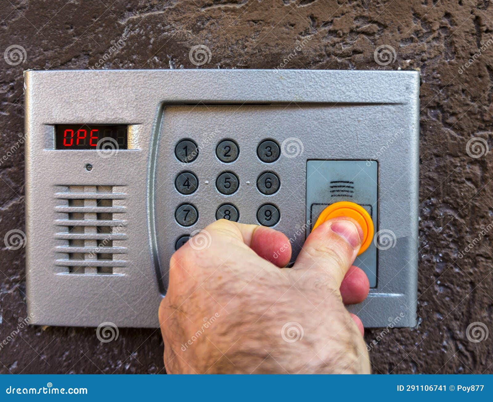 Hand with the Key from the Intercom, the Inscription on the Scoreboard ...