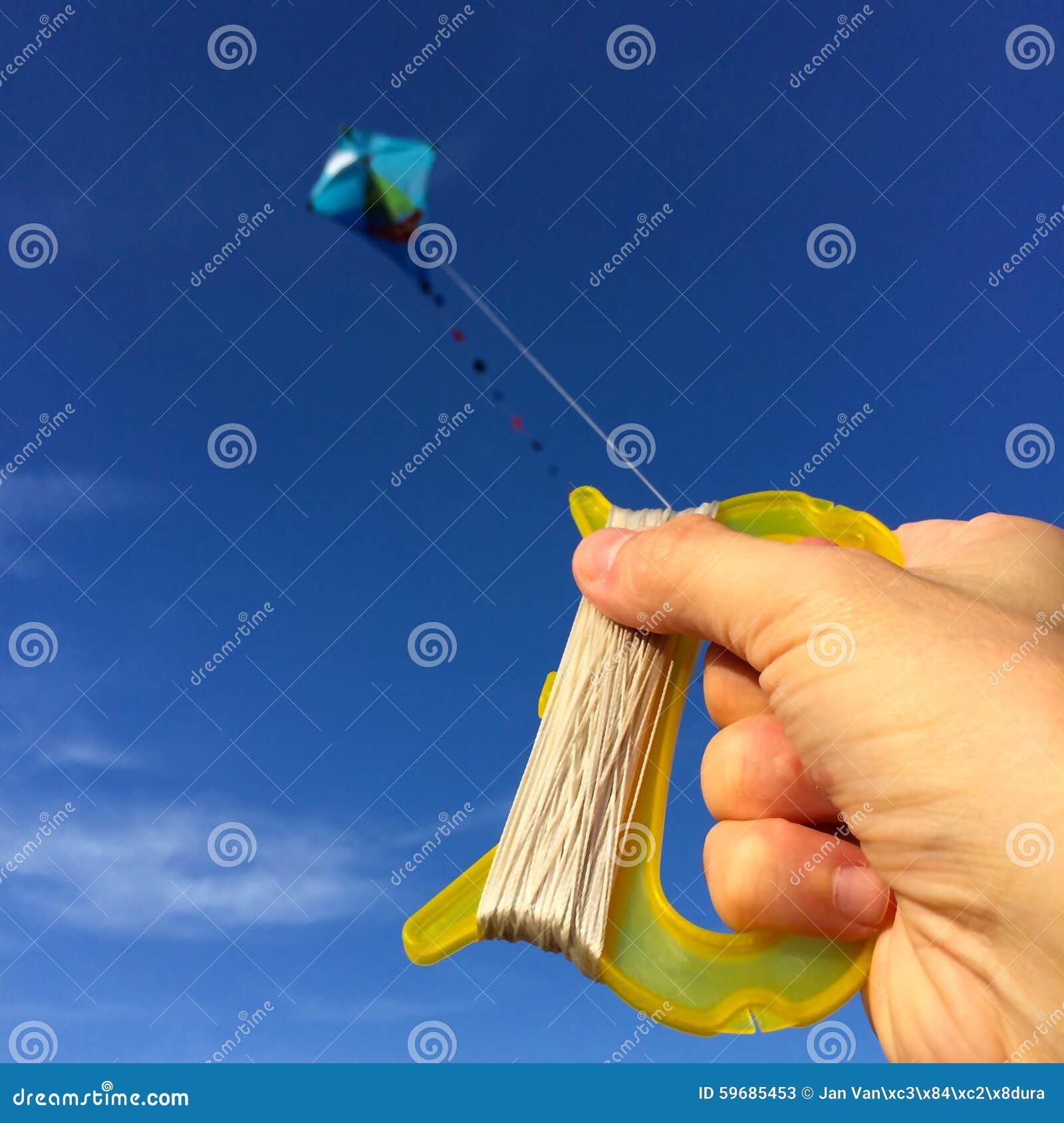 Hand with kite against sky stock image. Image of blue - 59685453