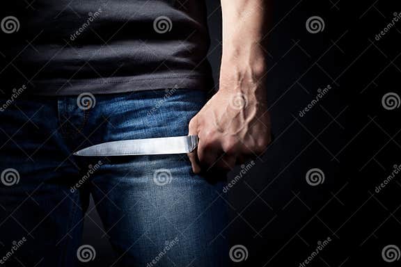 Hand with a knife stock photo. Image of sharp, jeans - 25157748