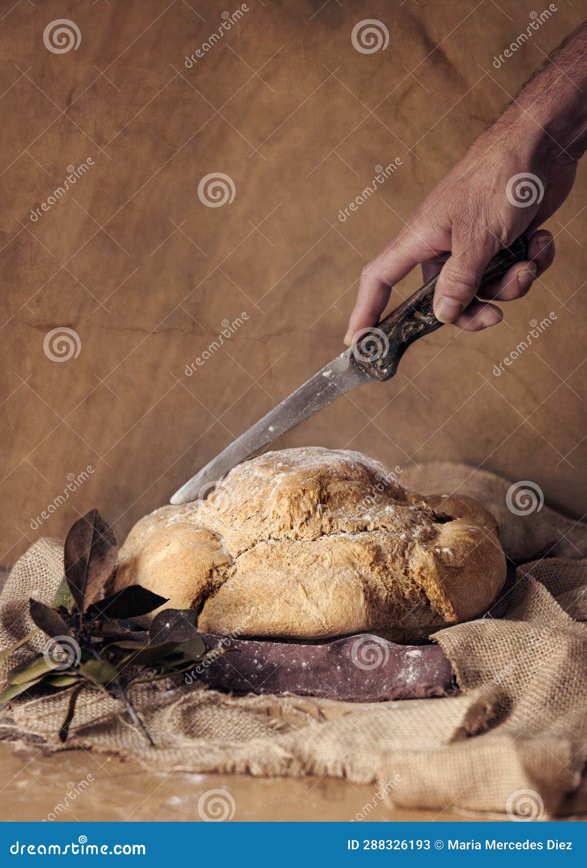 Hand with Knife Cutting Rustic Bread Stock Image - Image of black ...