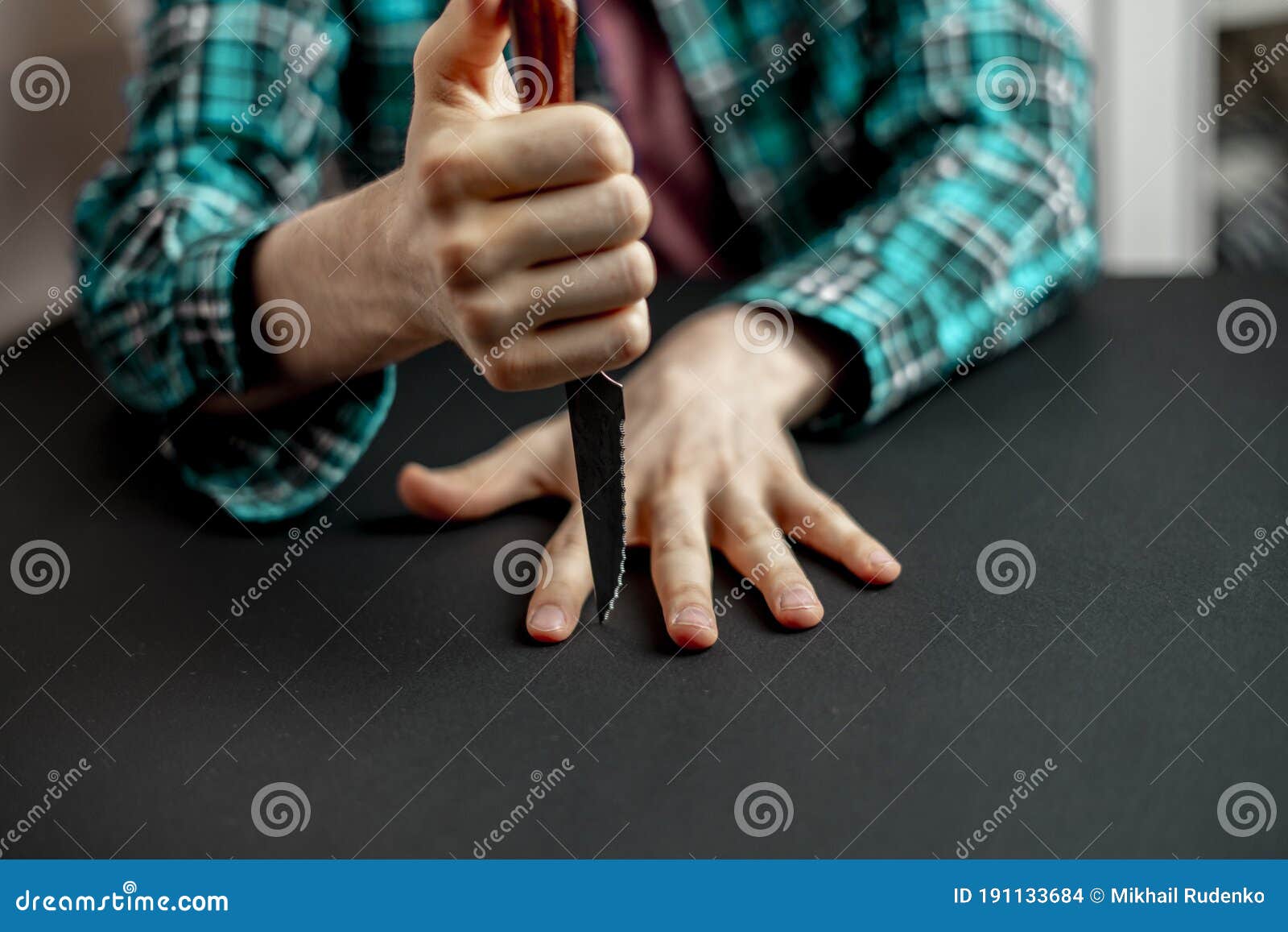 Hand with Knife Hitting between the Fingers on the Table, Playing the ...