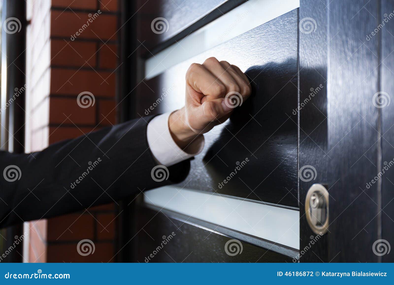 Hand knocking on the door stock photo. Image of jehovah - 46186872