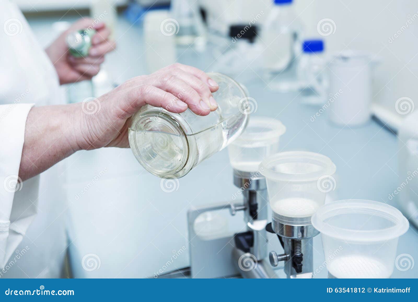 Hand Laboratory Pours Water into a Plactic Cup Stock Photo - Image of ...