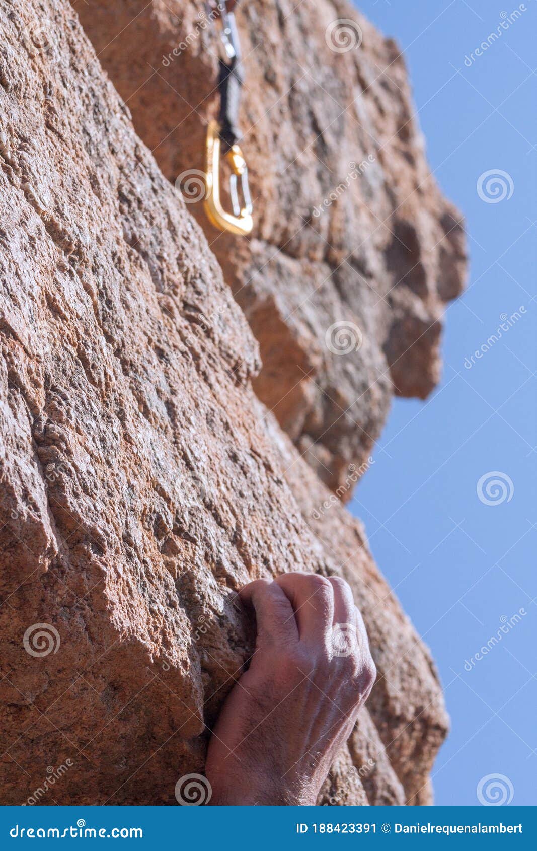 Hand of Lead Climber Grabbing a Rock with Quickdraw on Top in the ...