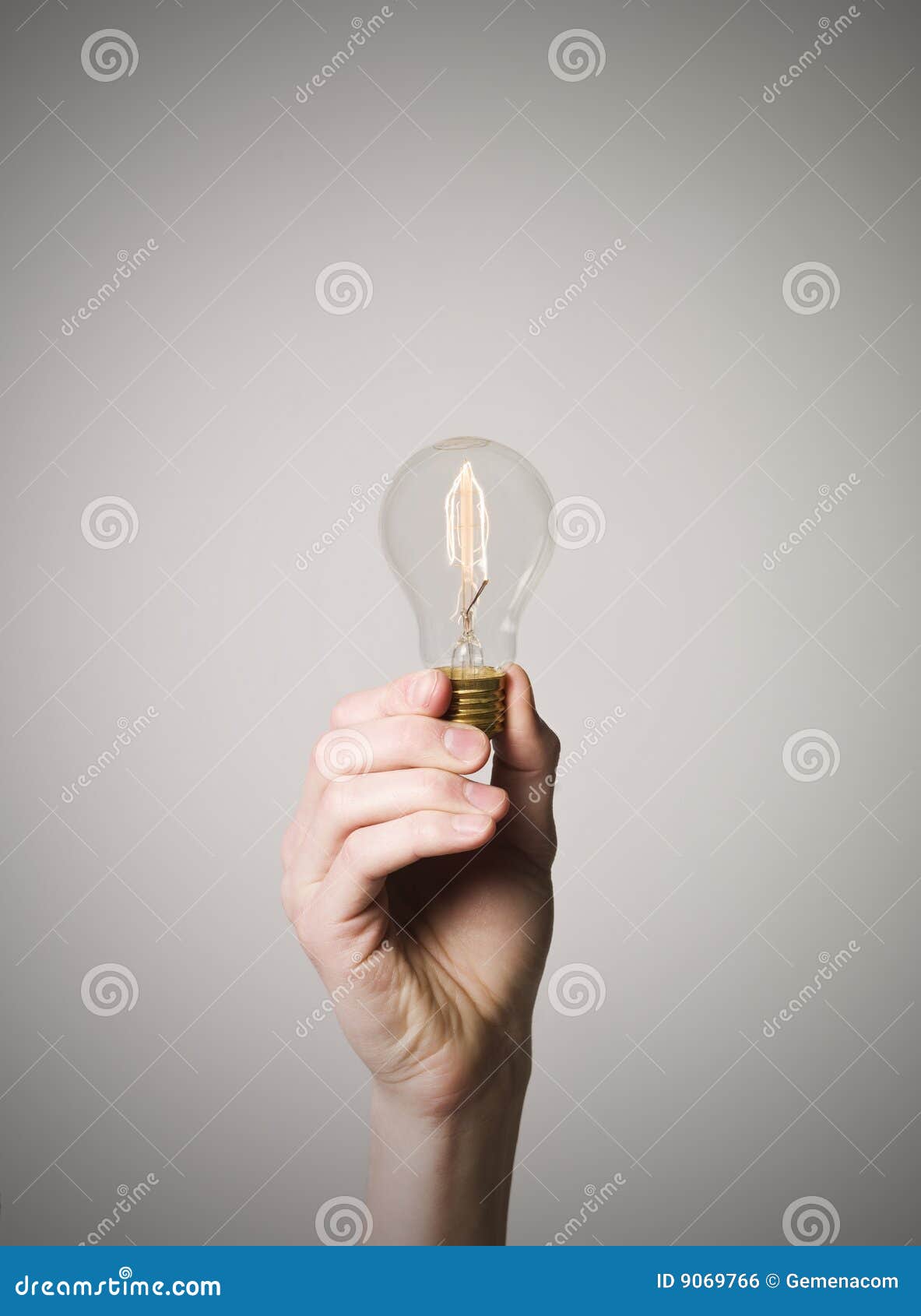 Hand with light bulb stock photo. Image of studio, grey - 9069766