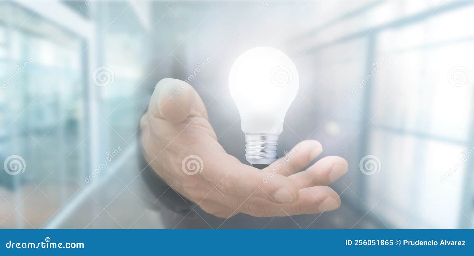 Hand with light bulb stock image. Image of background - 256051865