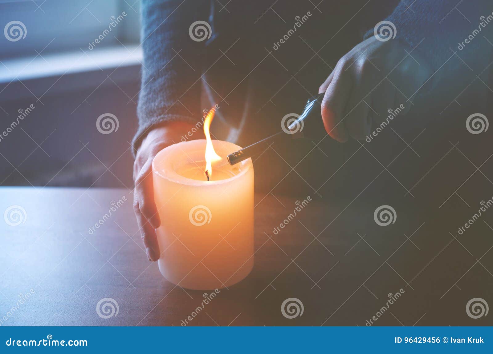 Hand lighting candle stock photo. Image of comfort, candle - 96429456