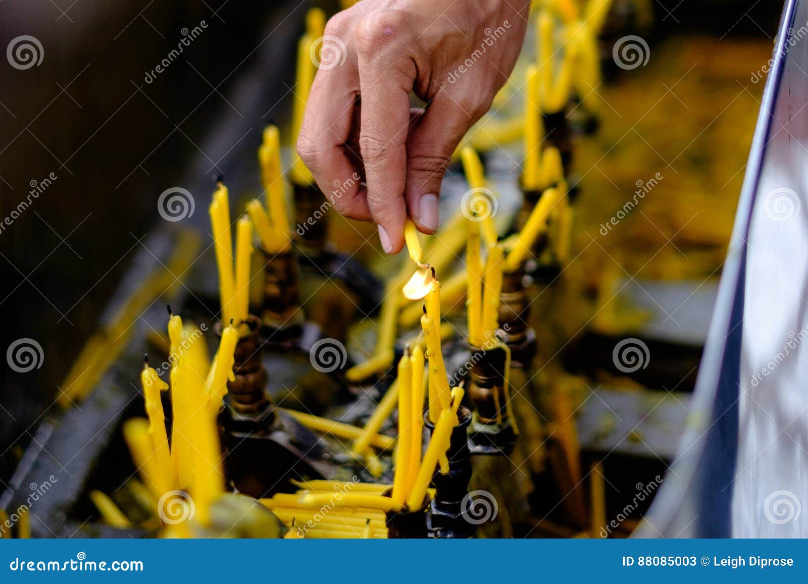 Hand lighting candles stock image. Image of indoors, burning - 88085003