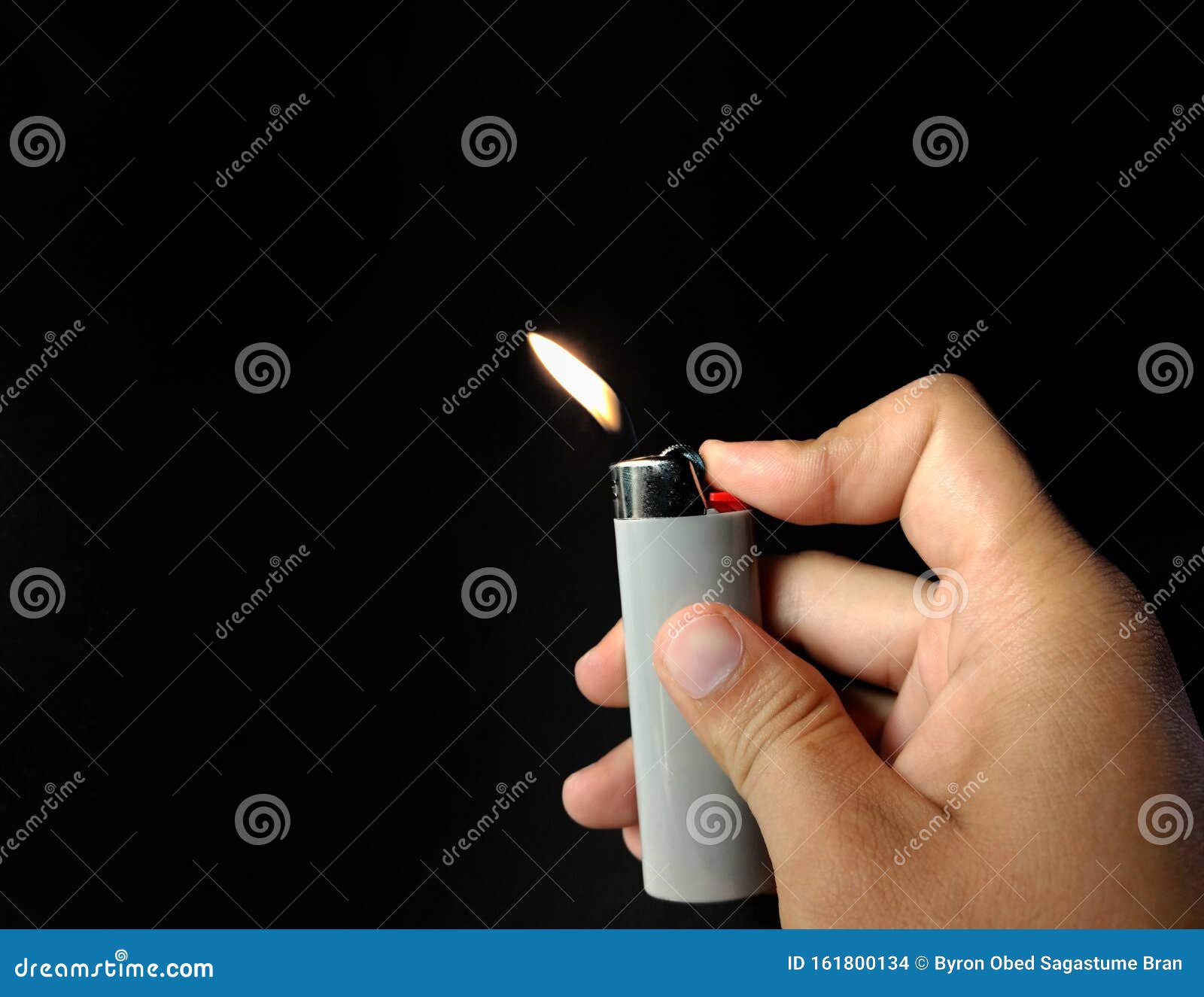 Hand Lighting a Lighter on Black Background. Decorative Concept Stock ...