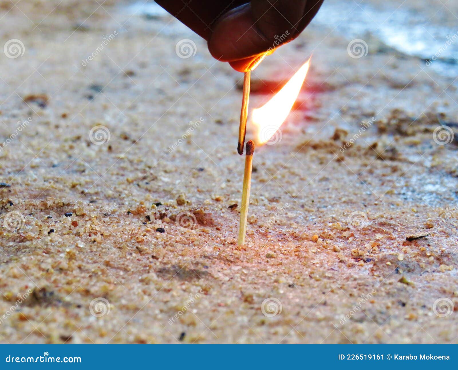 A Hand Lighting Match Sticks on the Ground Stock Image - Image of ...