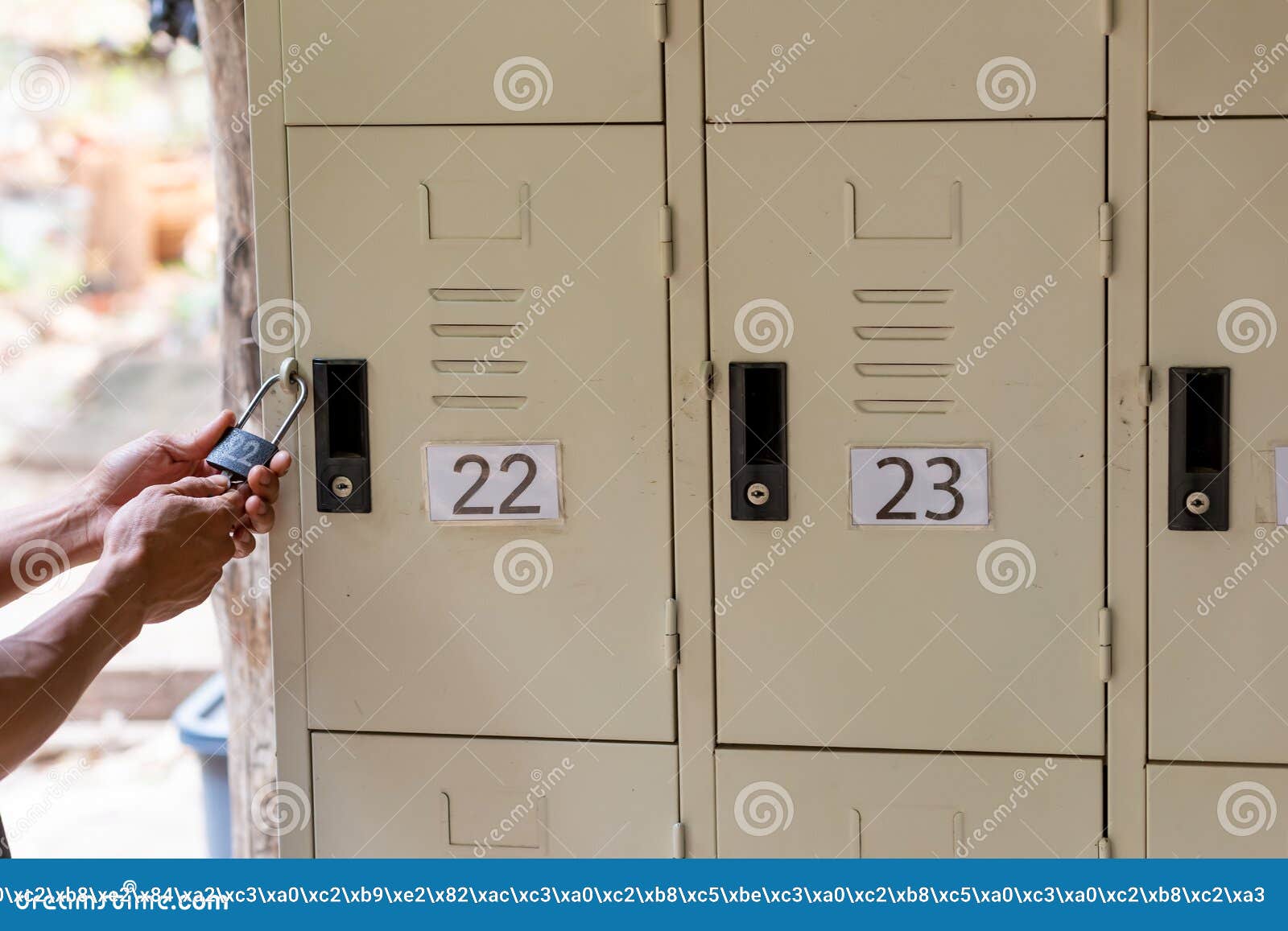 A Hand with a Locker Key Numbered Lockers for Safety Stock Image ...