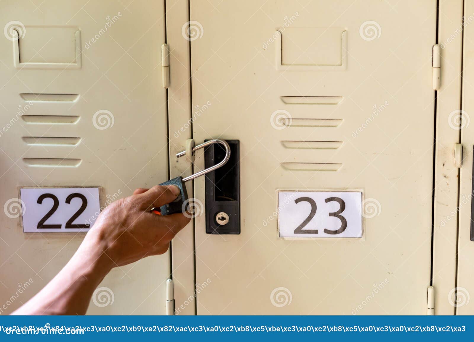 A Hand with a Locker Key Numbered Lockers for Safety Stock Image ...