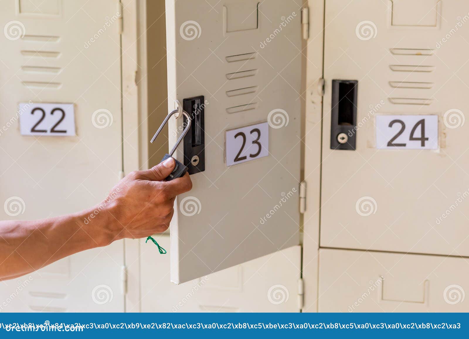 A Hand With A Locker Key Numbered Lockers For Safety Stock Photo ...