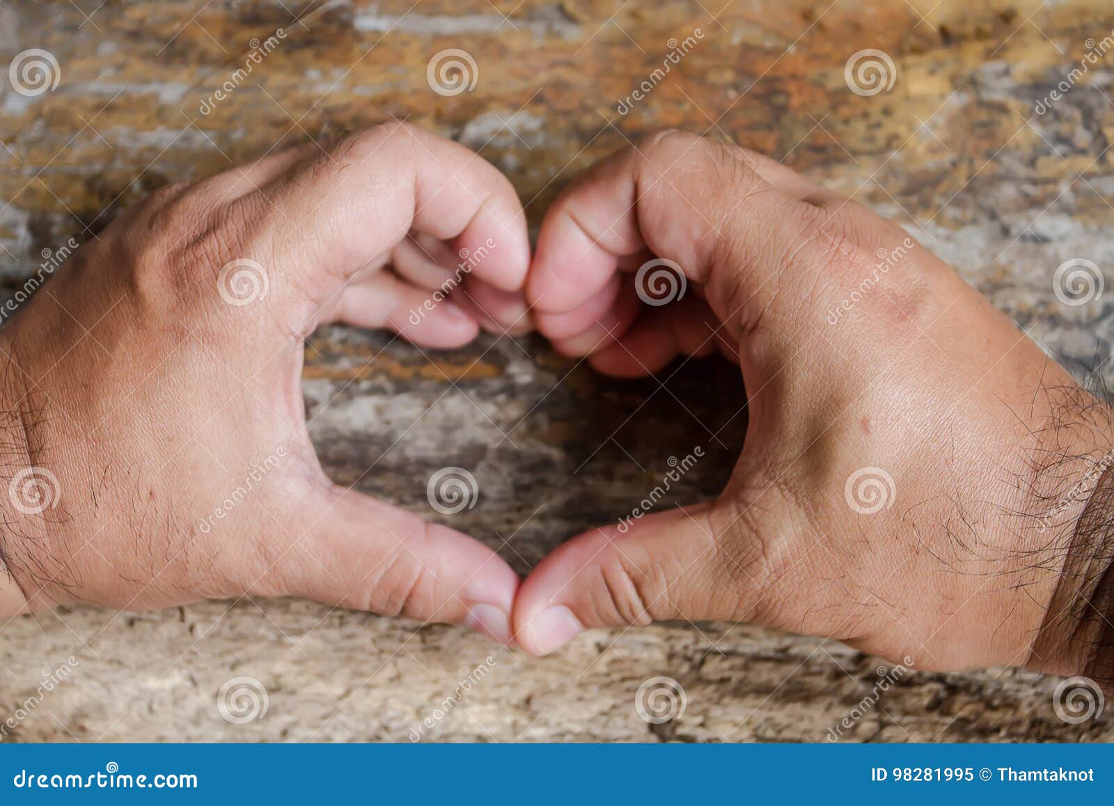 Hand Made into a Heart Shape on the Wood Table Background. Stock Image ...