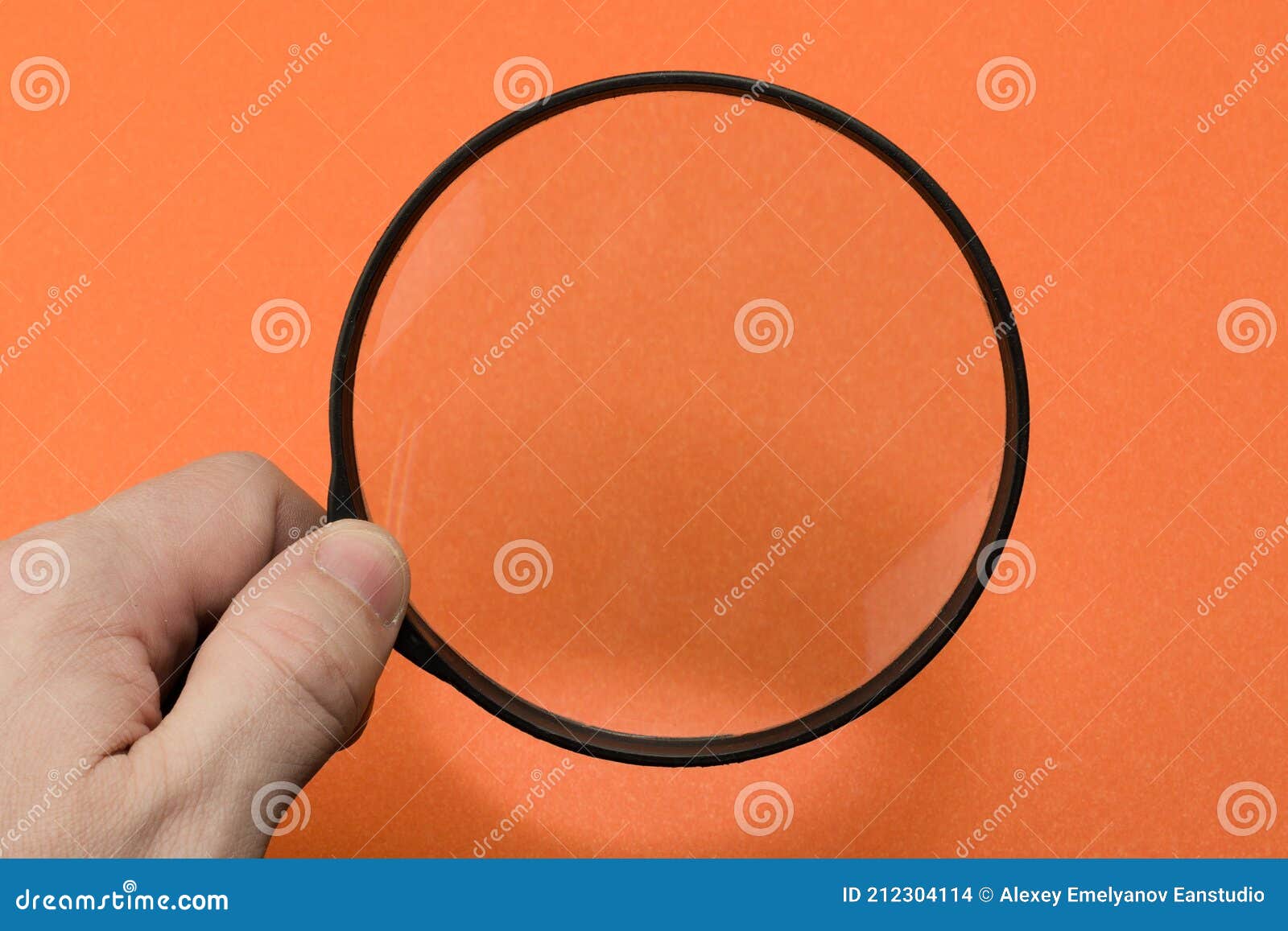 Hand with Magnifying Glass on Orange Background Stock Photo - Image of ...