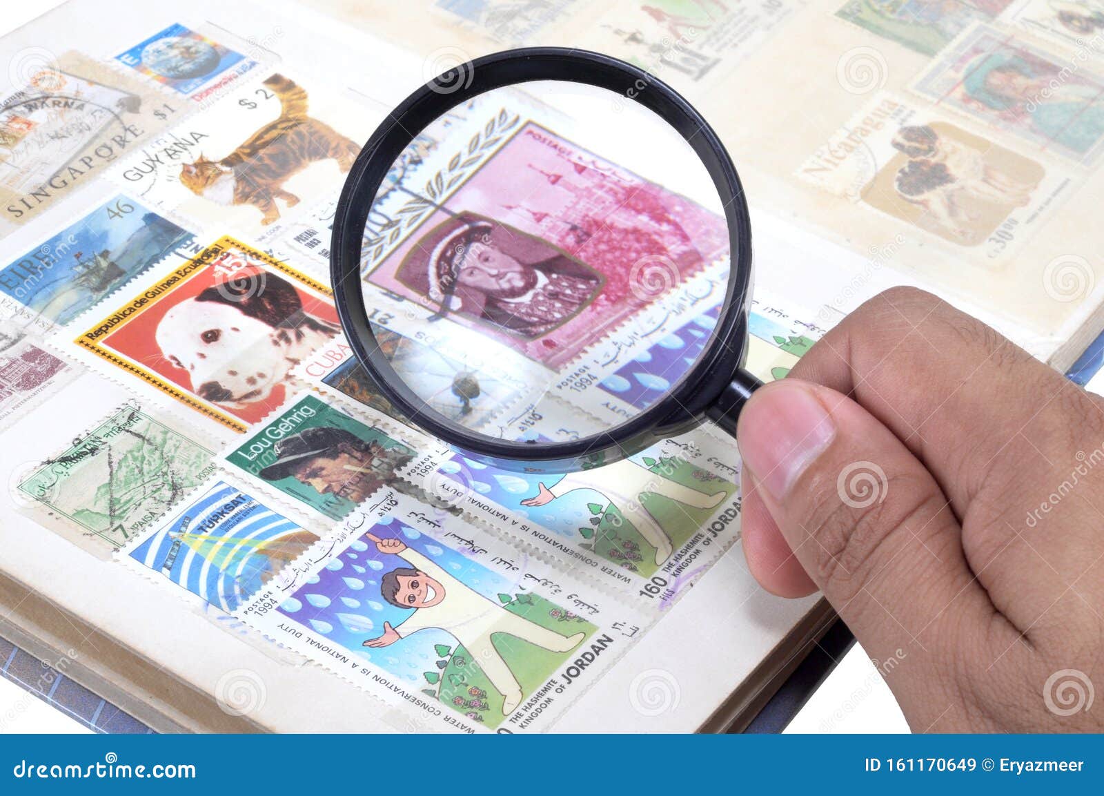 Hand with Magnifying Glass and Stamp Album Editorial Stock Image ...