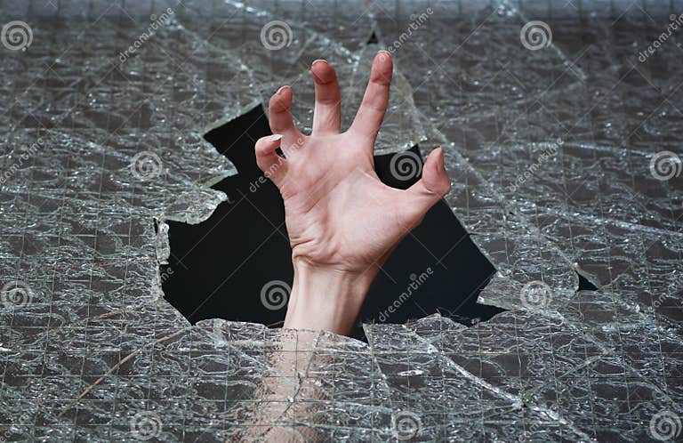 Hand Make Their Way through the Broken Glass Stock Photo - Image of ...
