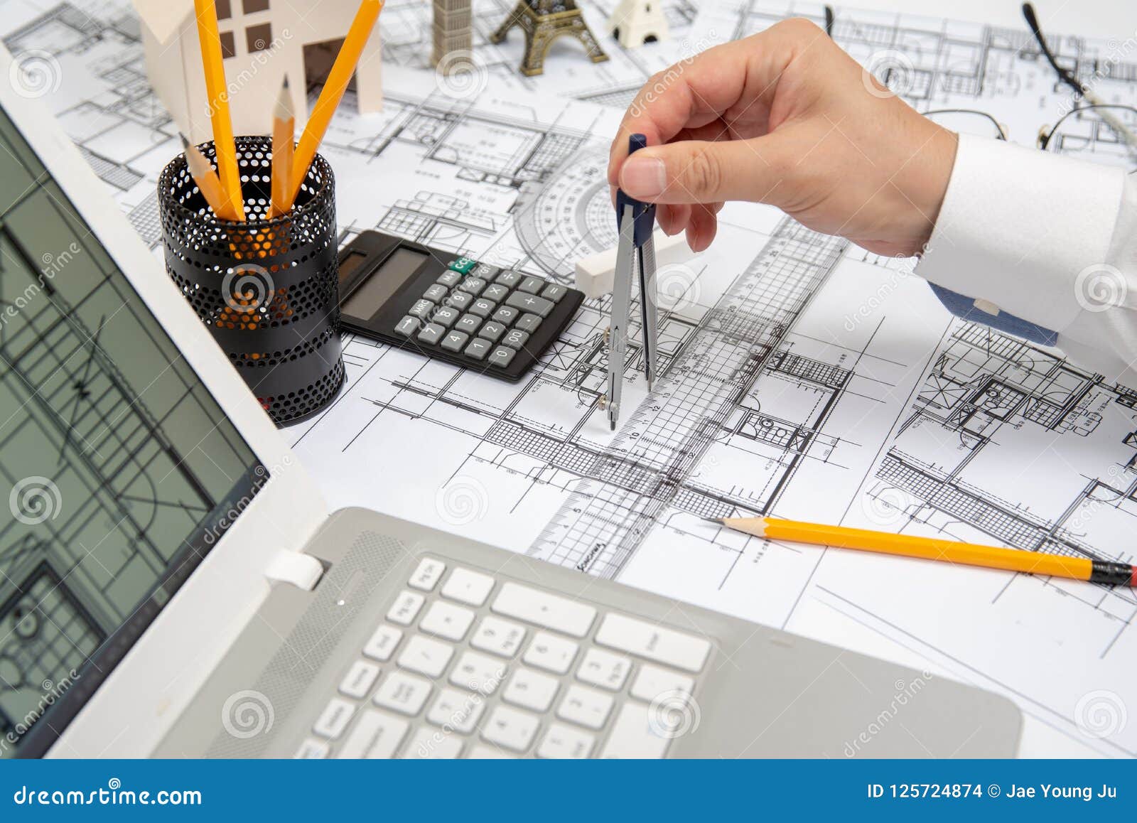 The Hand of a Male Architect Drawing a Design Using a Pencil. Stock ...
