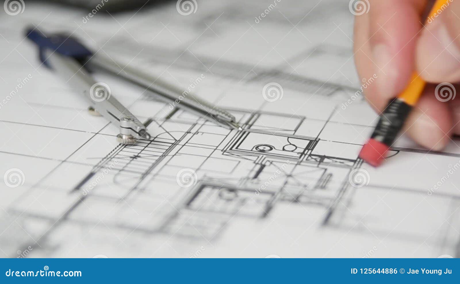 The Hand of a Male Architect Drawing a Design Using a Pencil. Stock ...