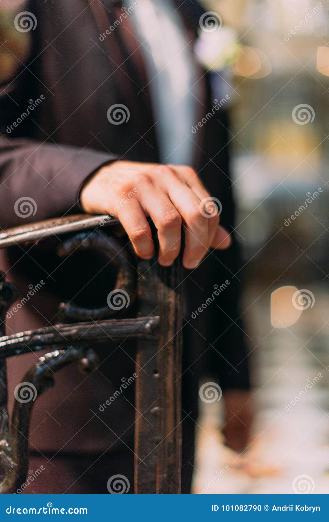 The Hand of the Man on the Black Iron Stair Railing. Stock Photo ...