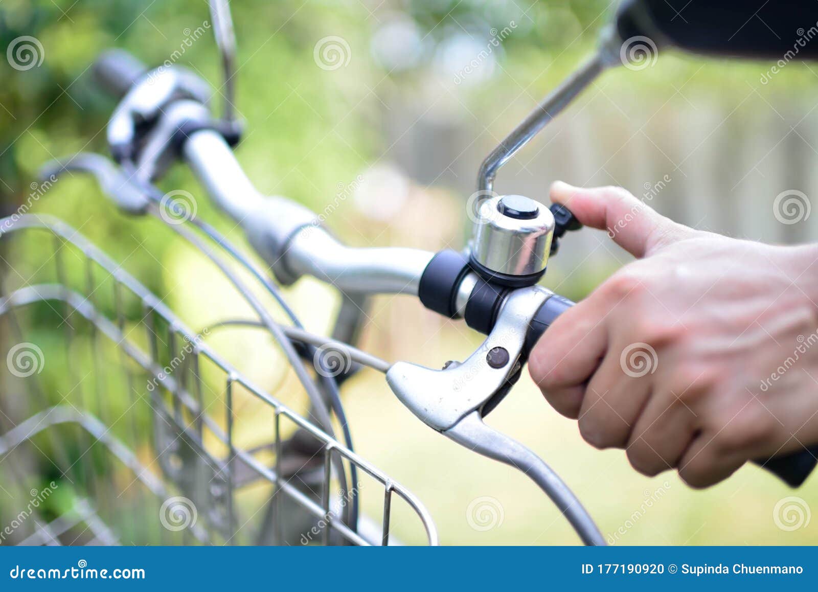 The Hand of the Man is Bouncing the Bicycle Bell. Stock Photo - Image ...