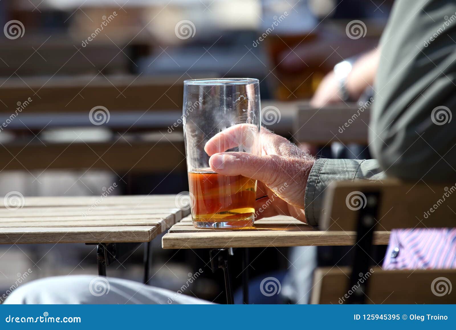 Hand of a Man Drinking Beer Stock Image - Image of happy, male: 125945395