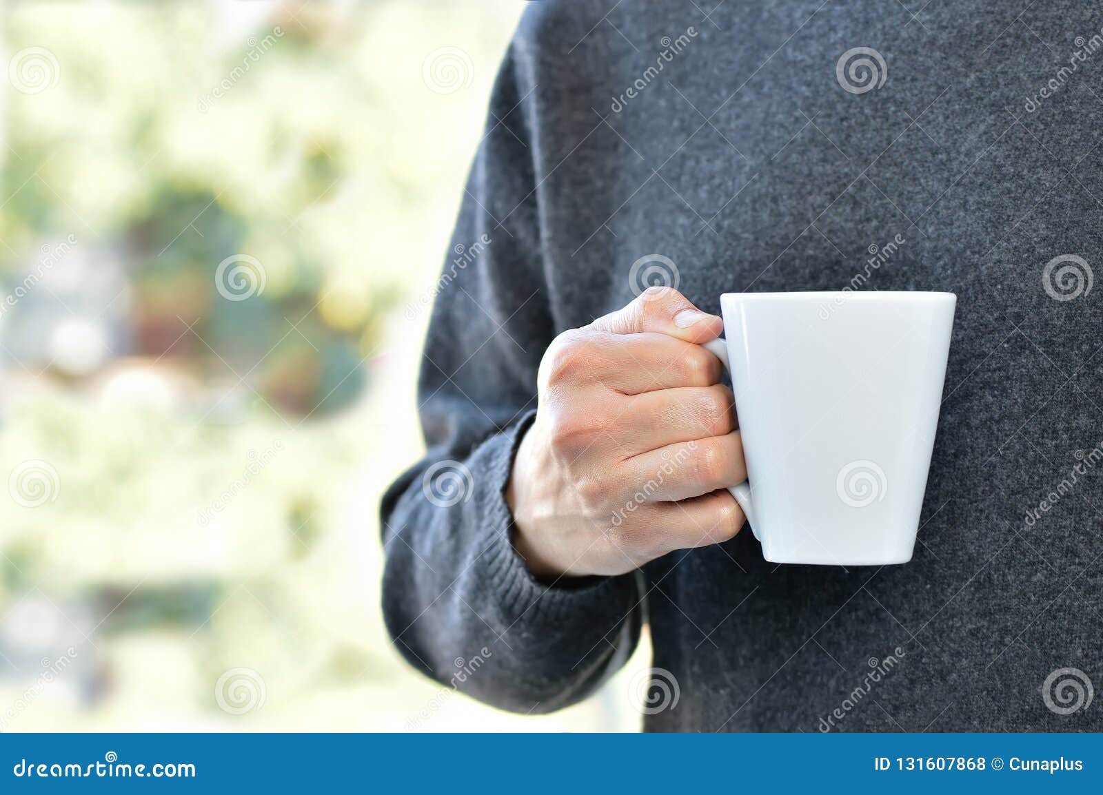 Man holding a coffee cup stock photo. Image of casual - 131607868
