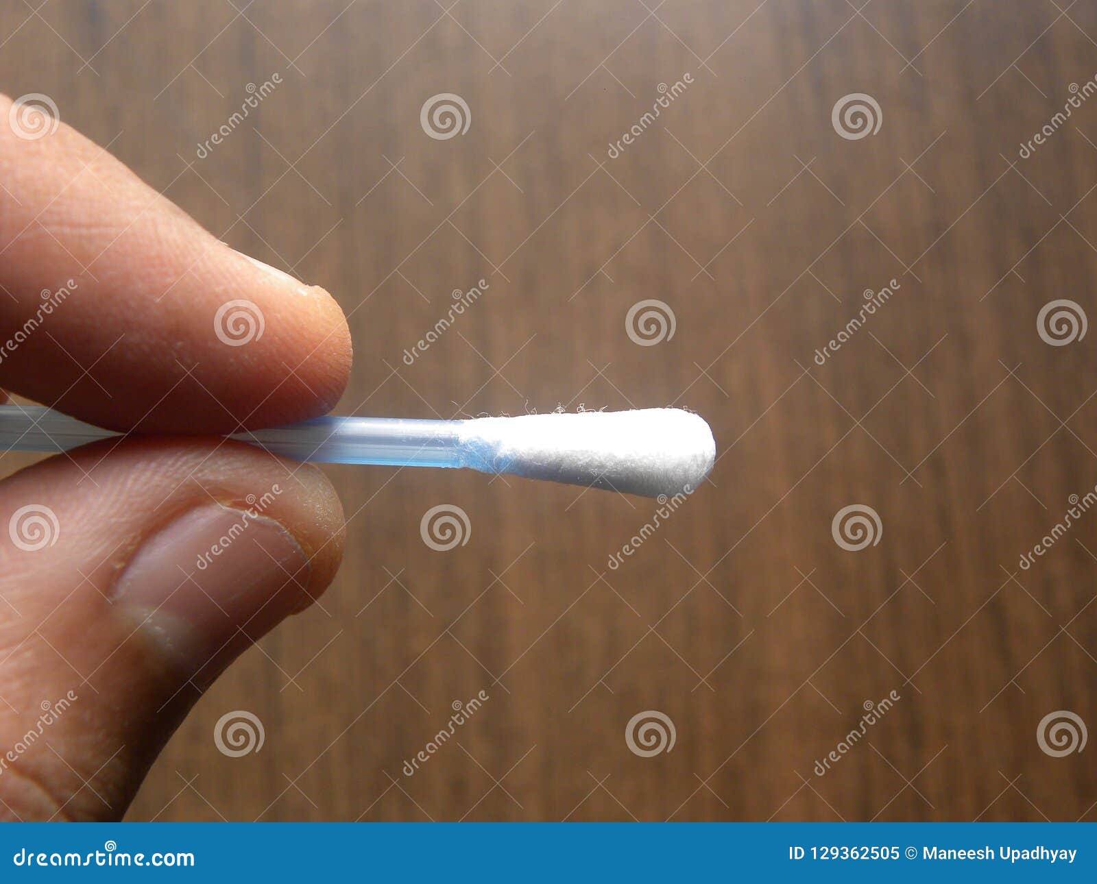 Hand holding cotton swab stock image. Image of clean - 129362505