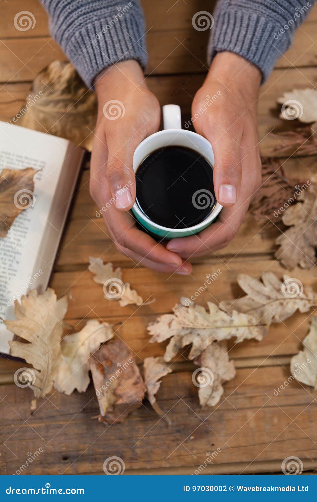 Hand of Man Holding Cup of Black Coffee and Autumn Leaves on Table ...