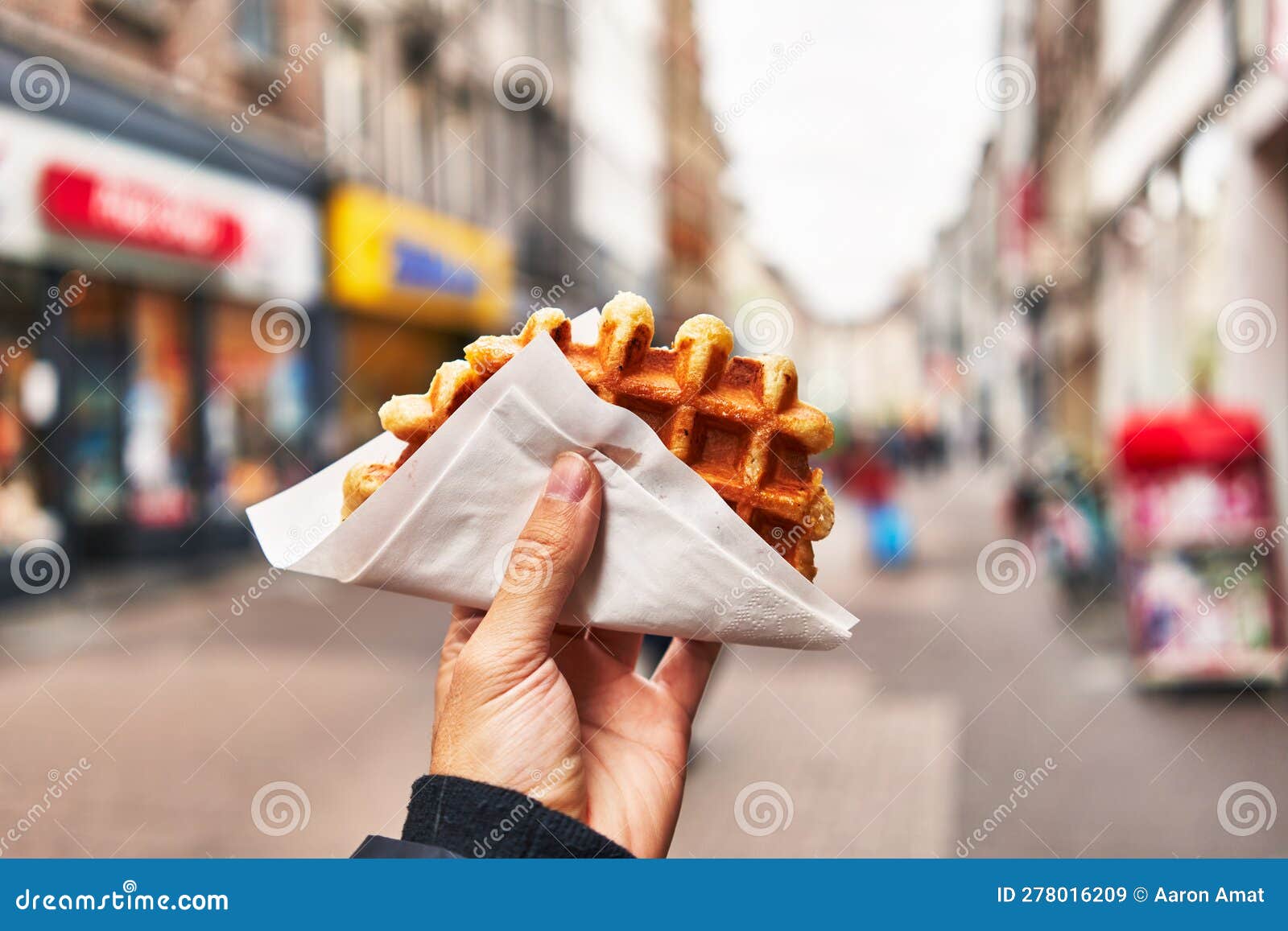 Hand of Man Holding Waffle at Street Stock Image - Image of road, sweet ...