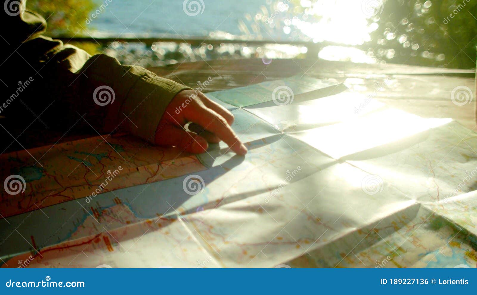 Hand of a Man on a Map with the Sun Stock Photo - Image of green ...