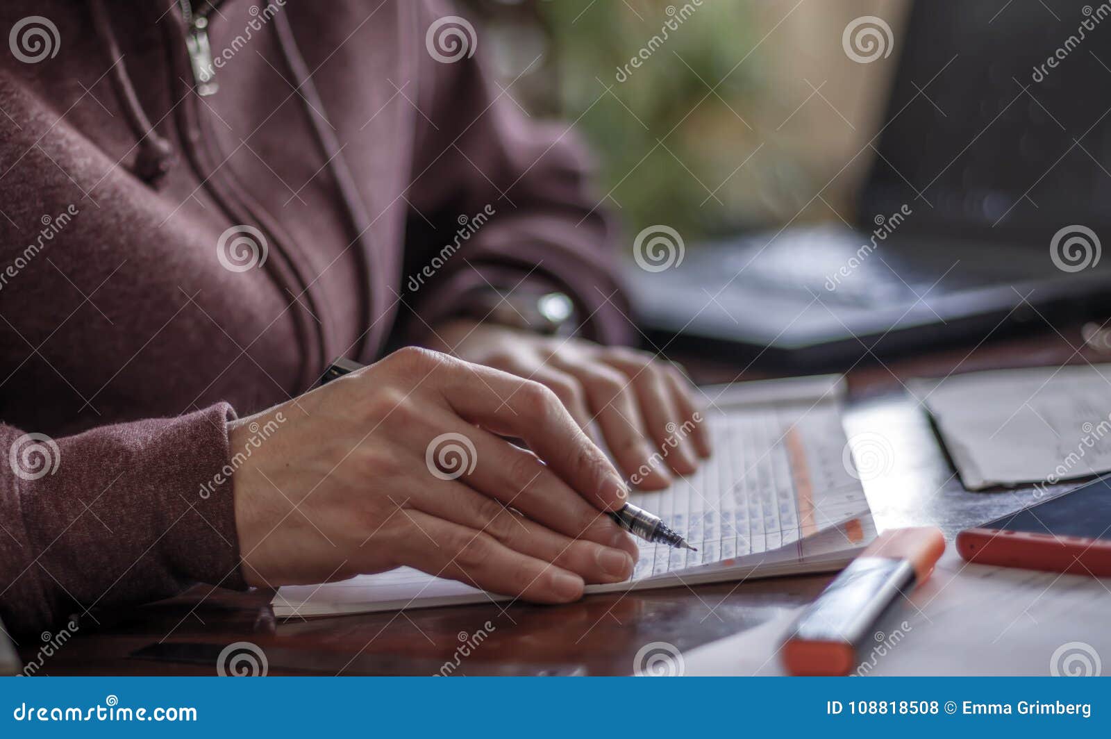 The Hand of a Man with a Pen Checking a Homework in a Notebook Stock ...