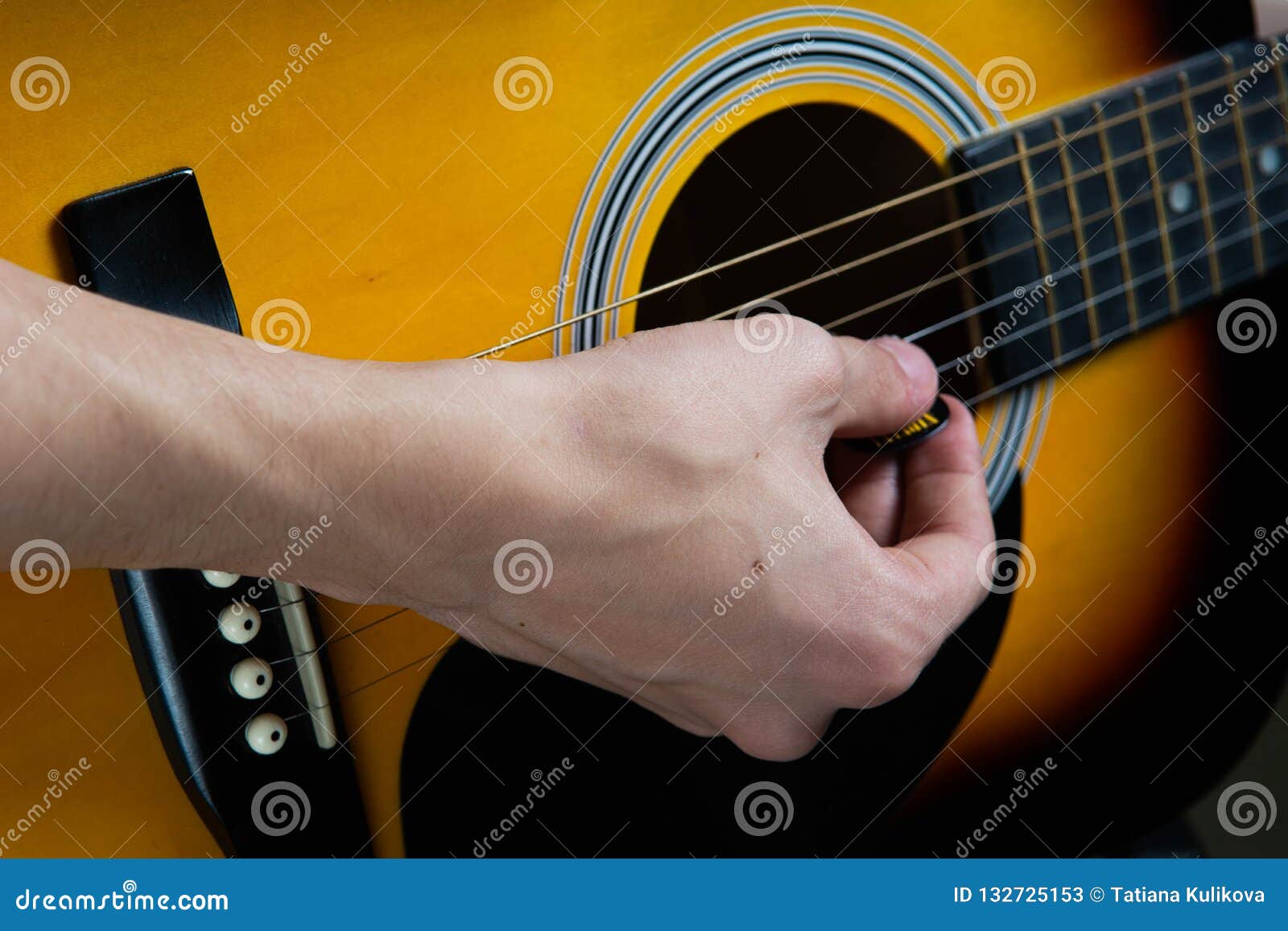 Hand of Man Playing Six-string Guitar on Wooden Background. Stock Image ...