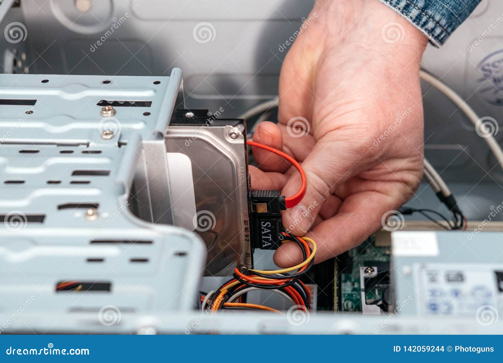 Hand of Man Plugging SATA Serial at Attachment, Serial ATA Data Cable ...