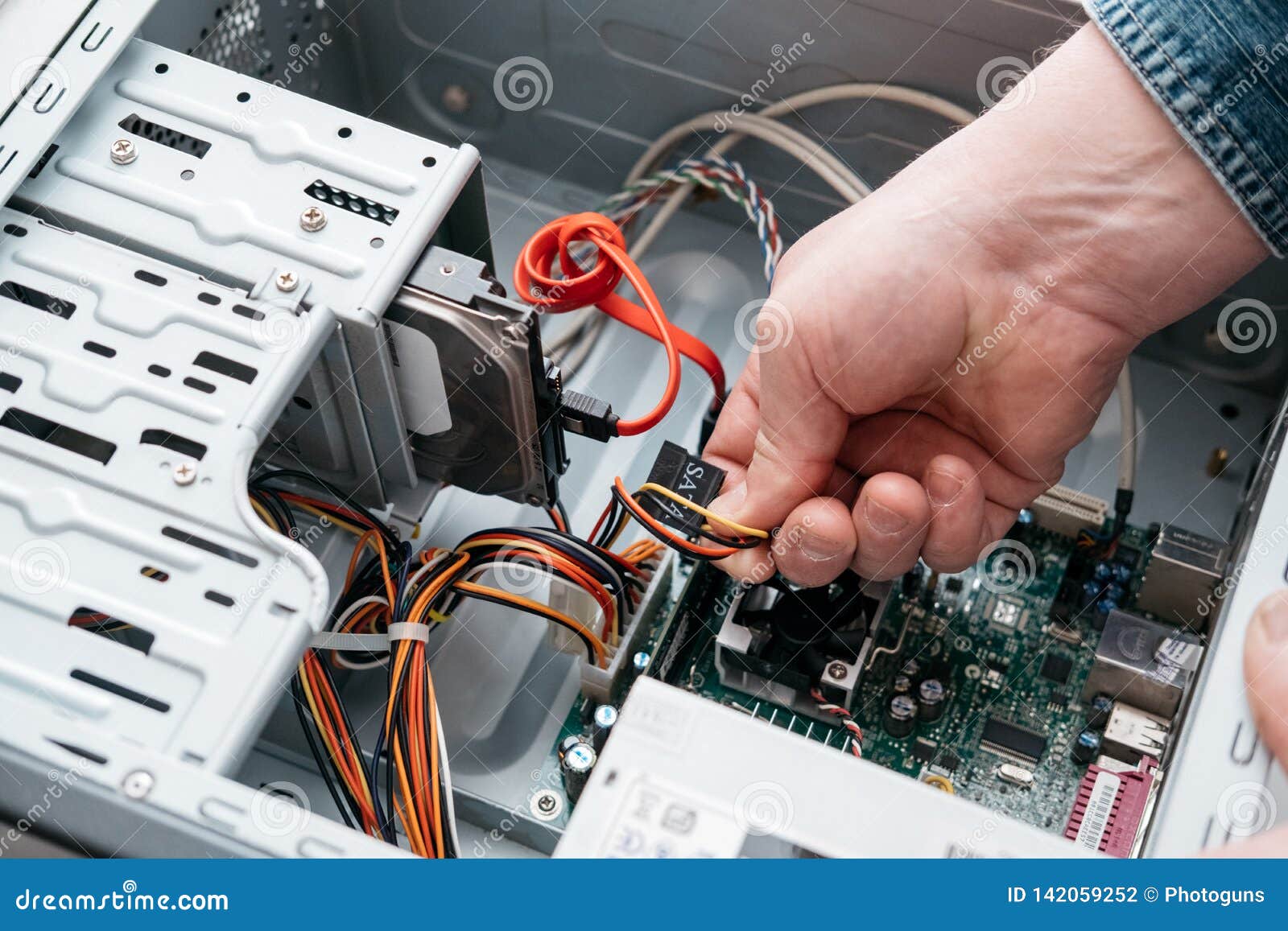 Hand of Man Plugging SATA Serial at Attachment, Serial ATA Data Cable ...