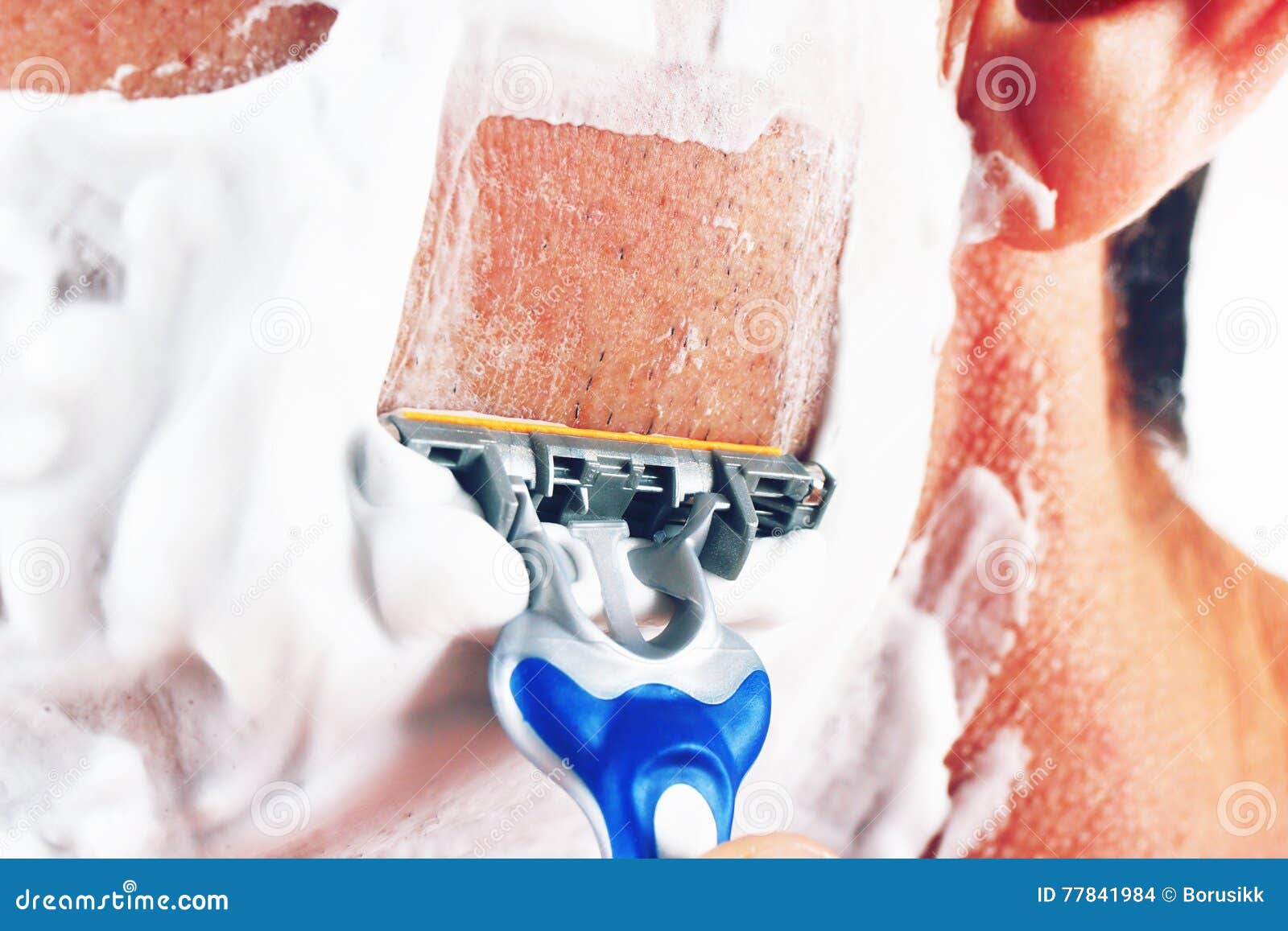 Hand Man with Razor Shaving His Face Close Up, Gently Toned Stock Photo ...